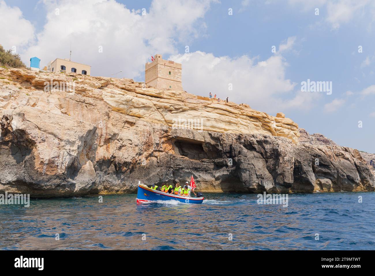Blue Grotto, Malta - August 25, 2019: Tourists on boat sail the Sea in ...