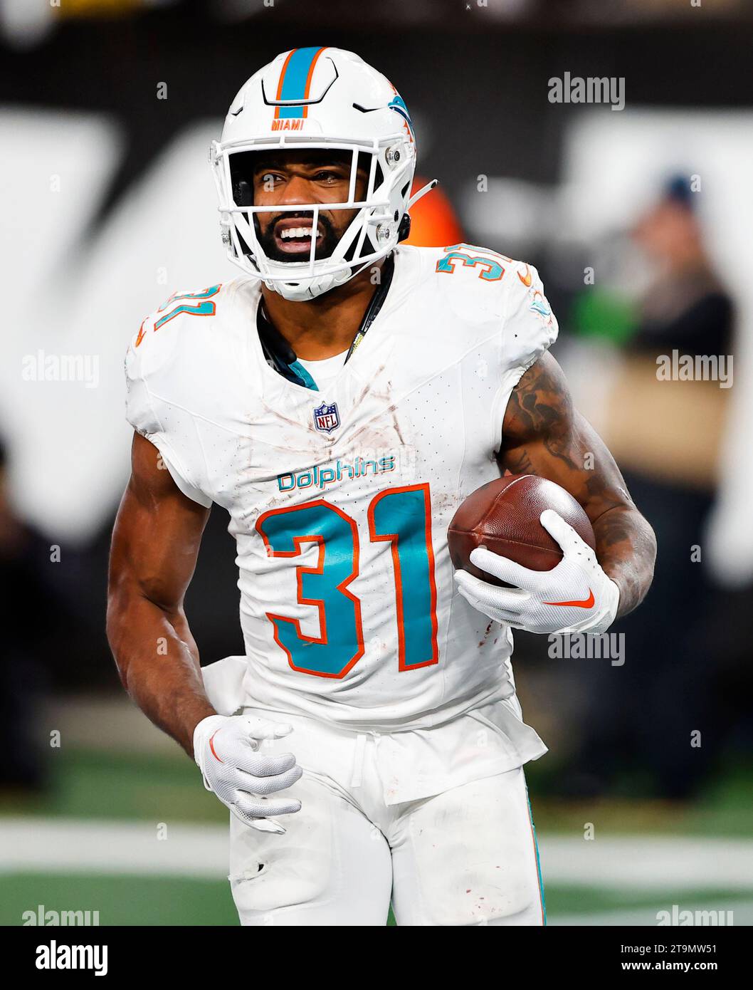 Miami Dolphins running back Raheem Mostert (31) smiles after scoring a touchdown against the New ...