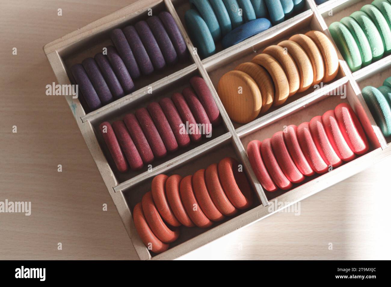 Colorful round wooden game pieces, used for counting, children's ...