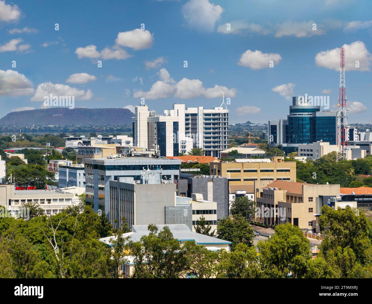 aerial view of Gaborone skyline, cityscape over green area and main ...