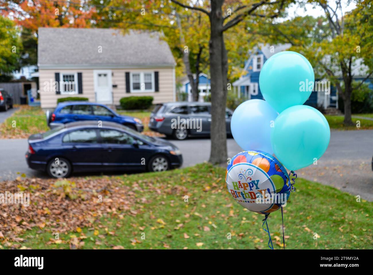 Colored party balloon outside an American house Stock Photo - Alamy