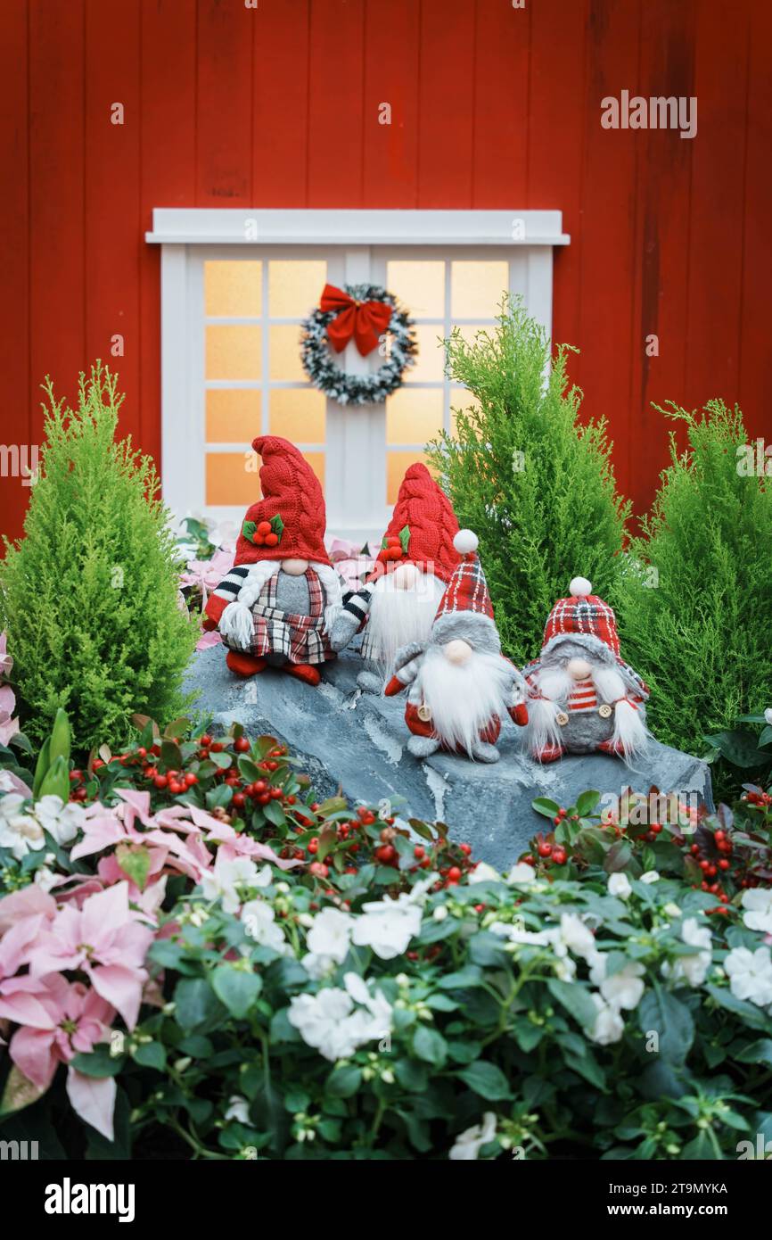 An outdoor Christmas scene featuring Santa Claus and his elves gathered ...