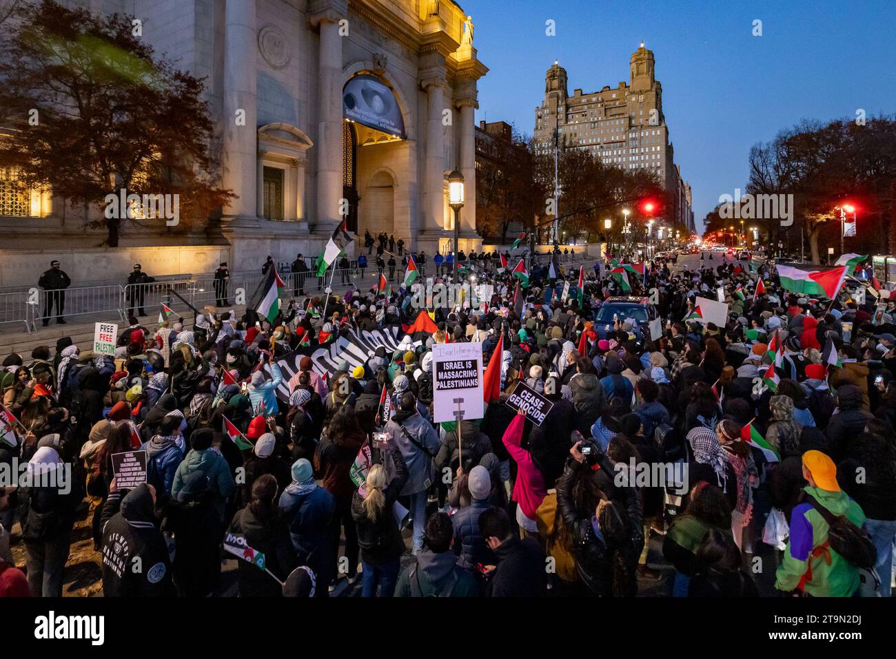 NEW YORK, NEW YORK - NOVEMBER 25: Pro-Palestine protesters stands hold ...