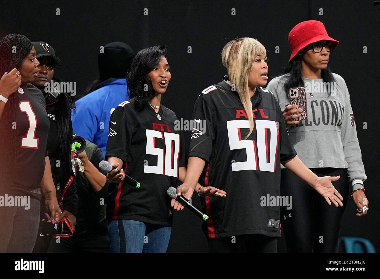 Members of the R&B and hip hop group TLC speak to officials as their ...
