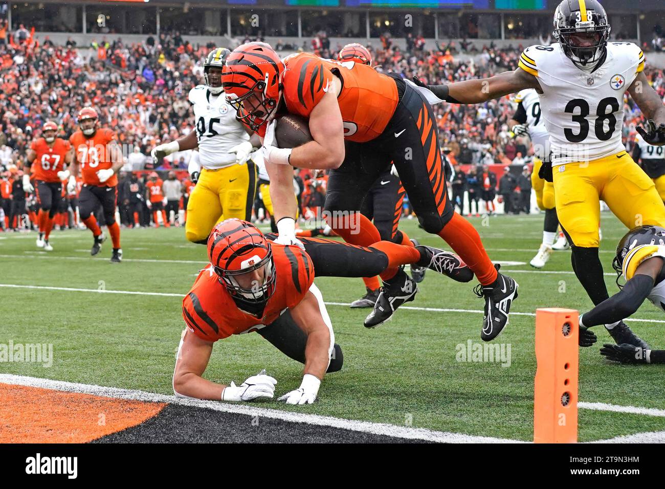 Cincinnati Bengals tight end Drew Sample, center, collides with ...