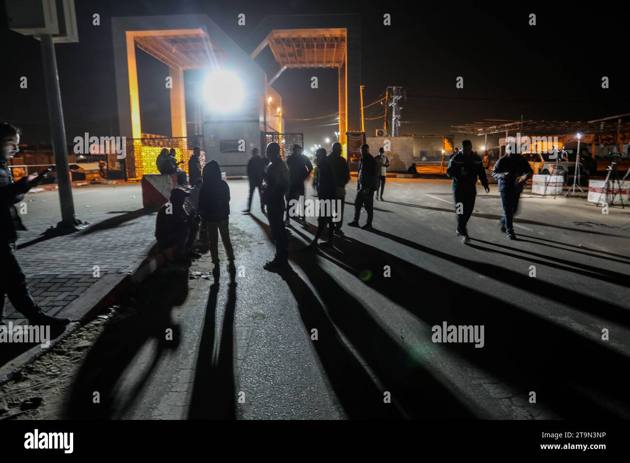 Rafah, Palestinian Territories. 26th Nov, 2023. Palestinians gather in ...