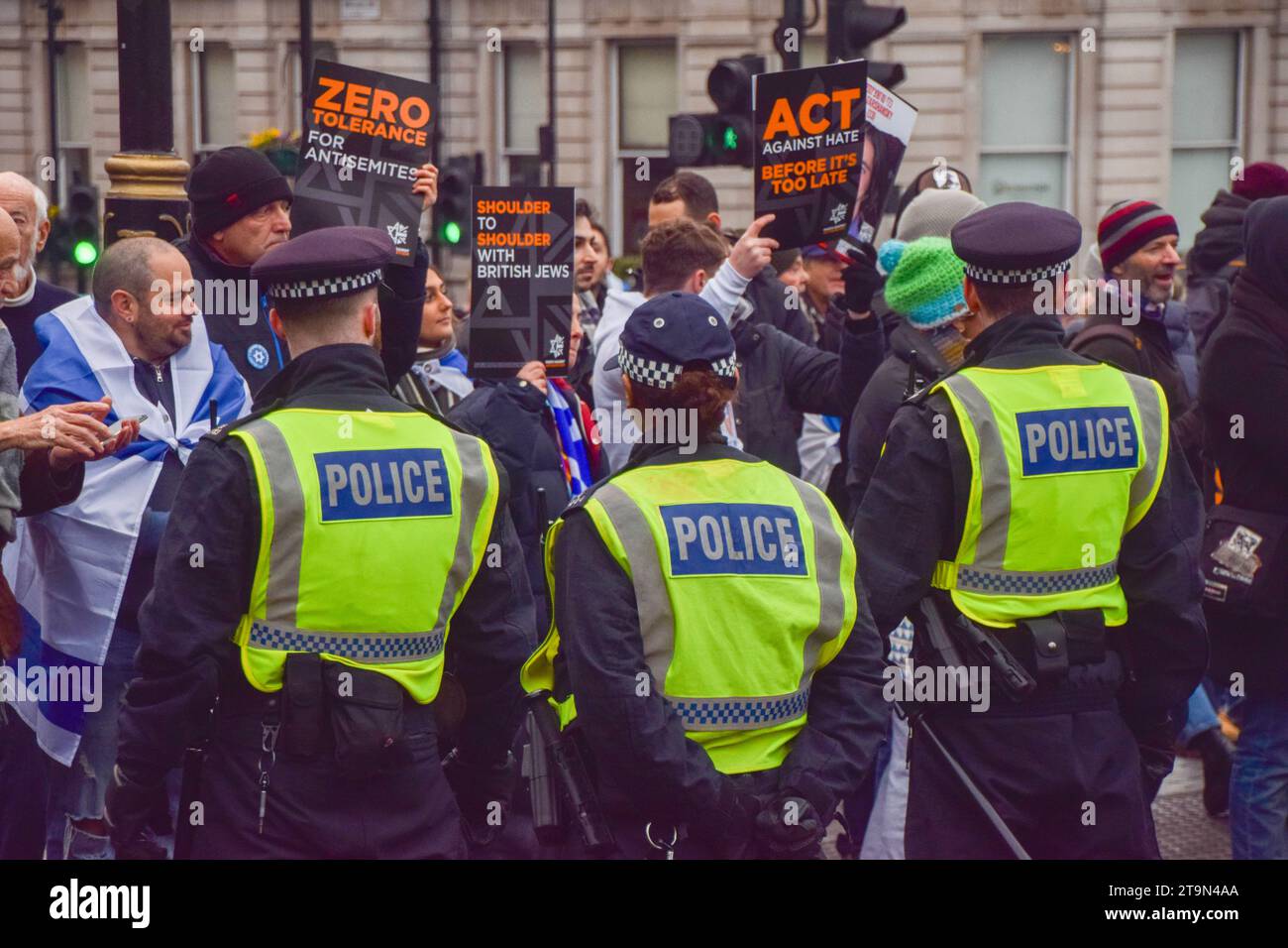 London, England, UK. 26th Nov, 2023. Police officers intervene as anti ...