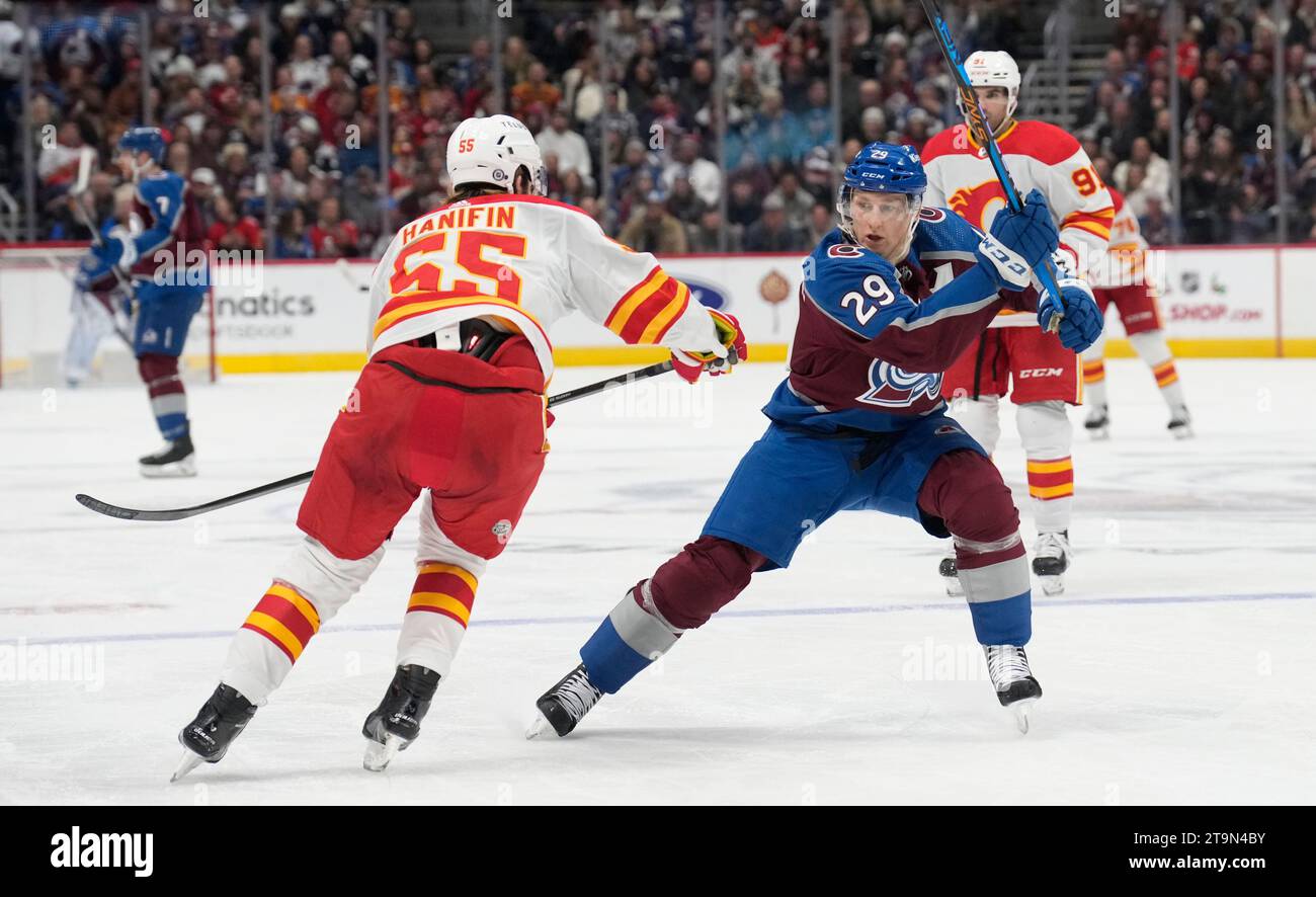 Colorado Avalanche center Nathan MacKinnon (29) slips past Calgary ...