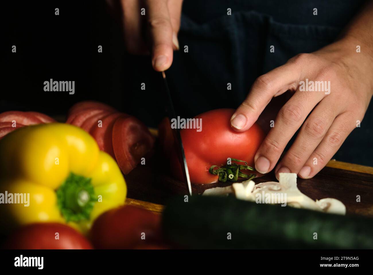Closeup cooks hand slicing fresh hi-res stock photography and images ...