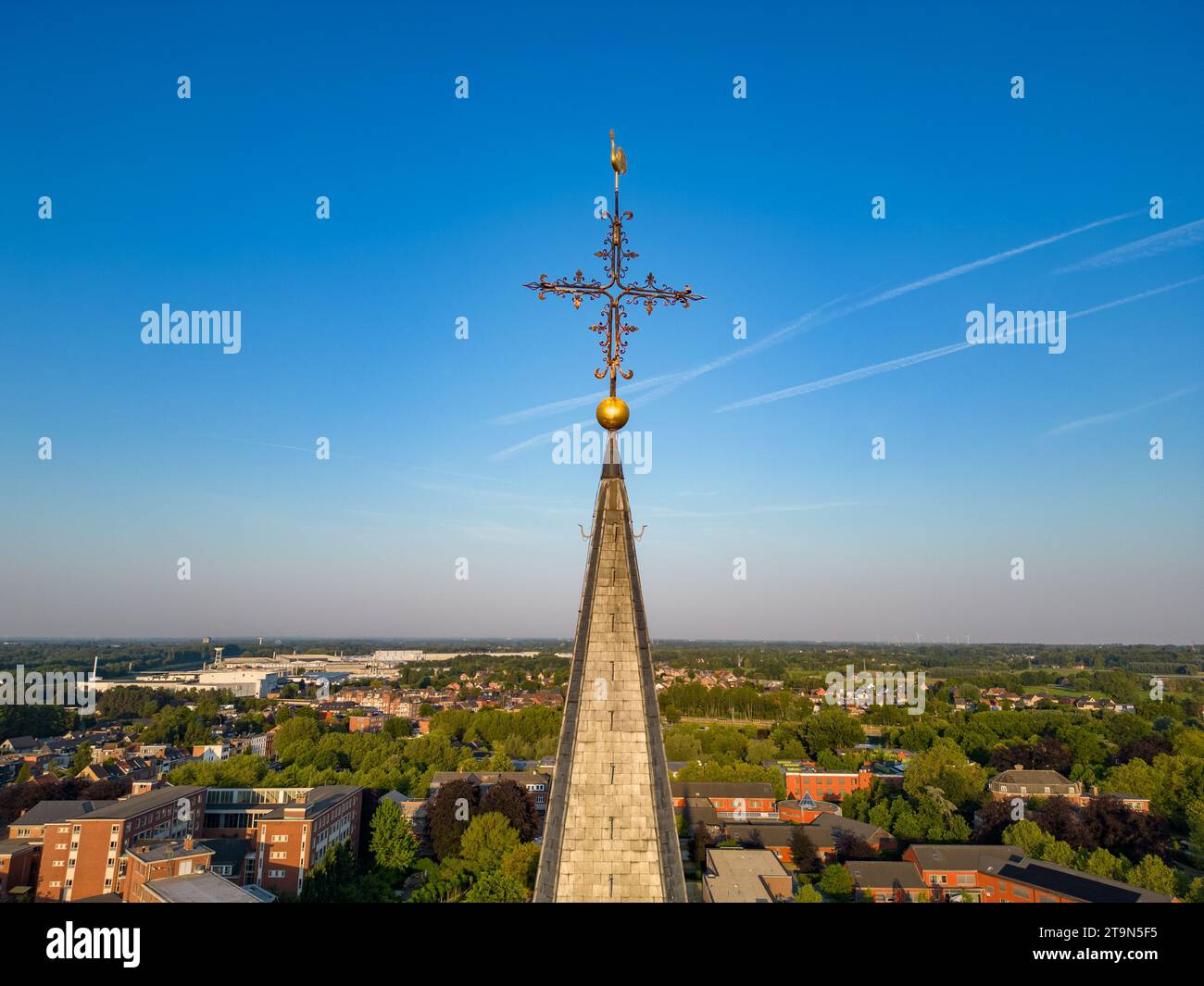 Captured from an aerial perspective, this image features the spire of a ...