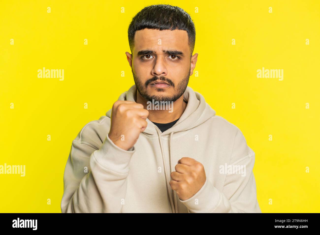 Aggressive angry Indian Hindu man trying to fight at camera, shaking ...