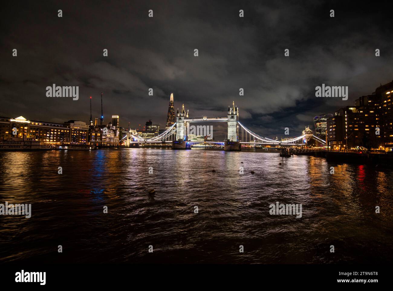 Tower Bridge spanning the Thames as the night draws in on a November ...