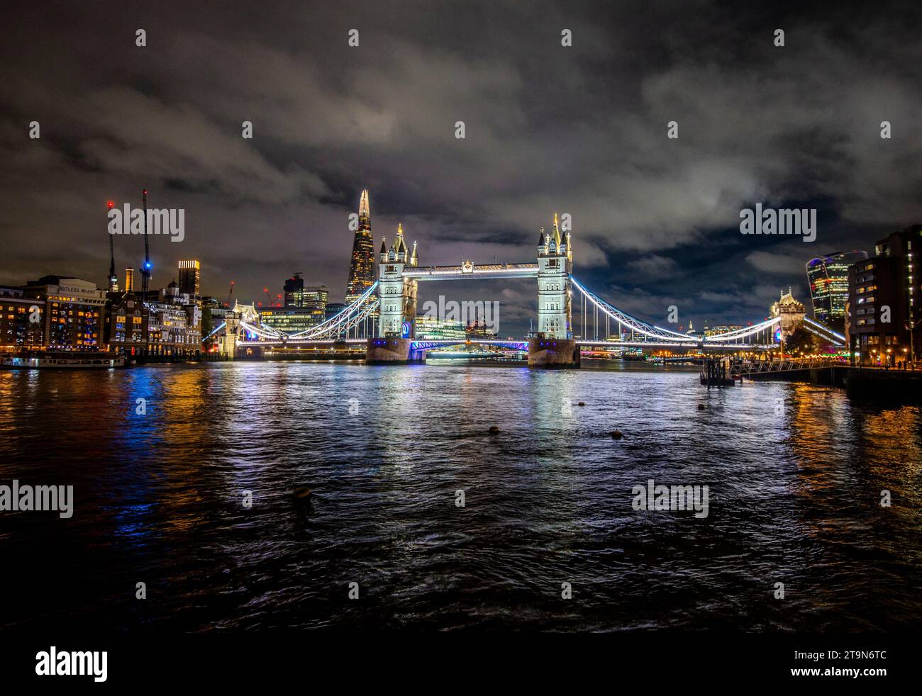 Tower Bridge spanning the Thames as the night draws in on a November ...