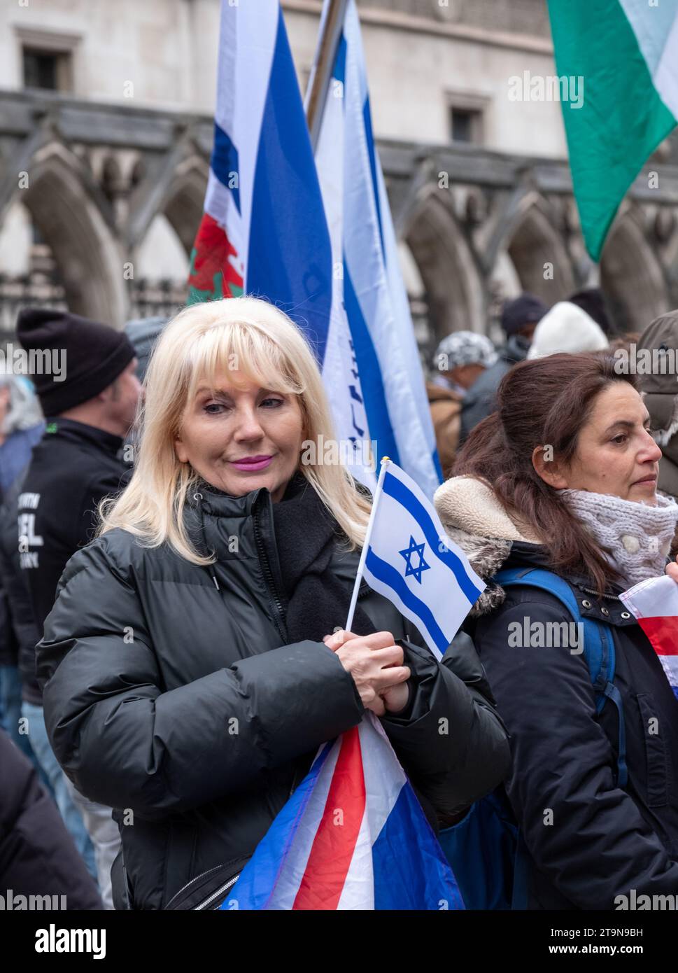 Woman supporter holding Israeli flag, at the March Against Antisemitism ...