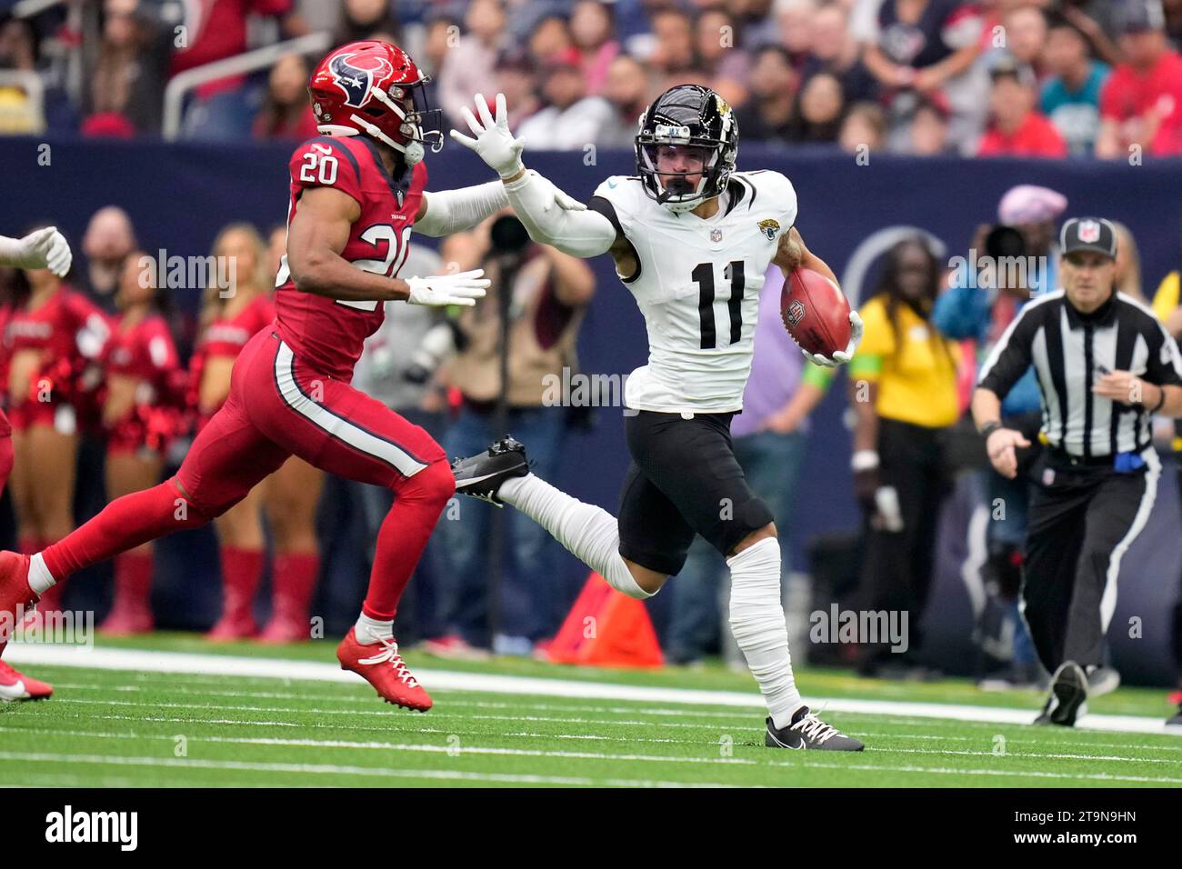 Jacksonville Jaguars wide receiver Parker Washington (11) fights off a ...