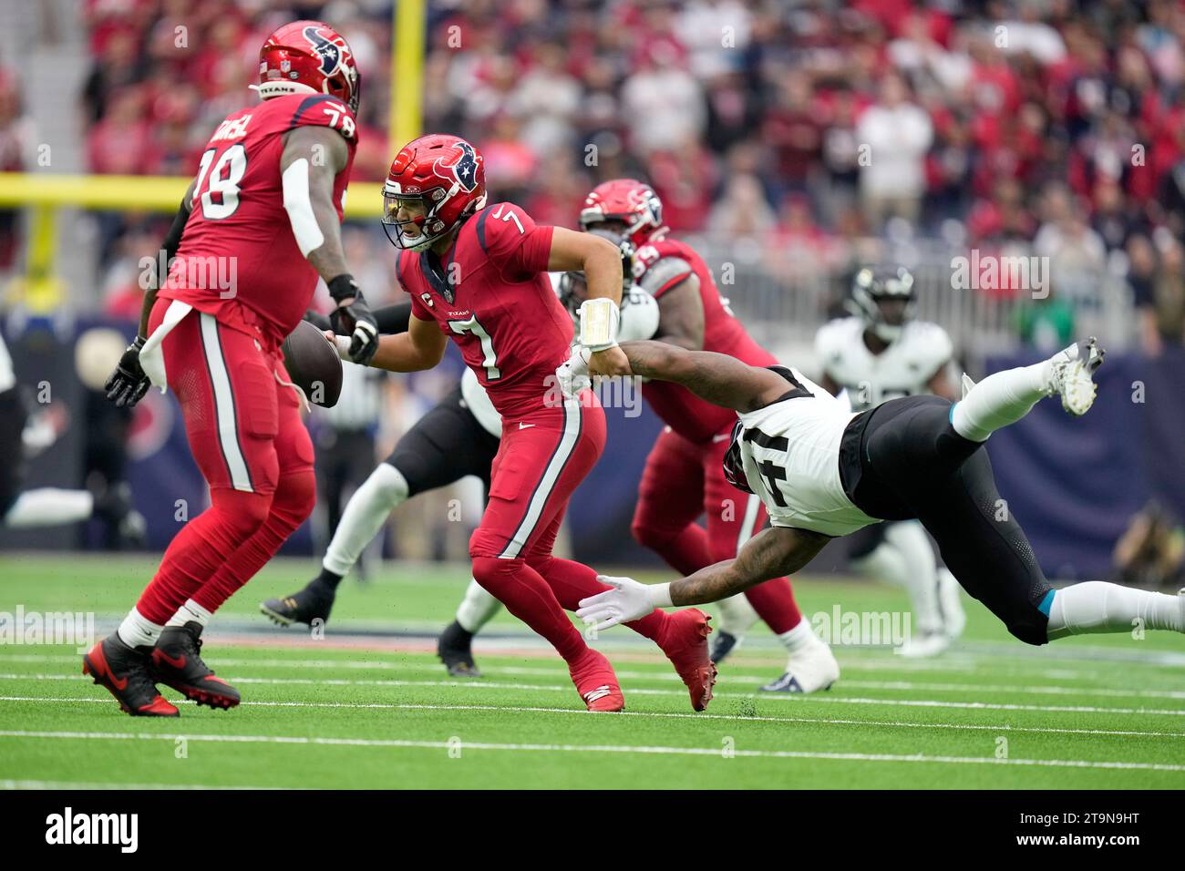 Houston Texans quarterback C.J. Stroud (7) avoids pressure from ...