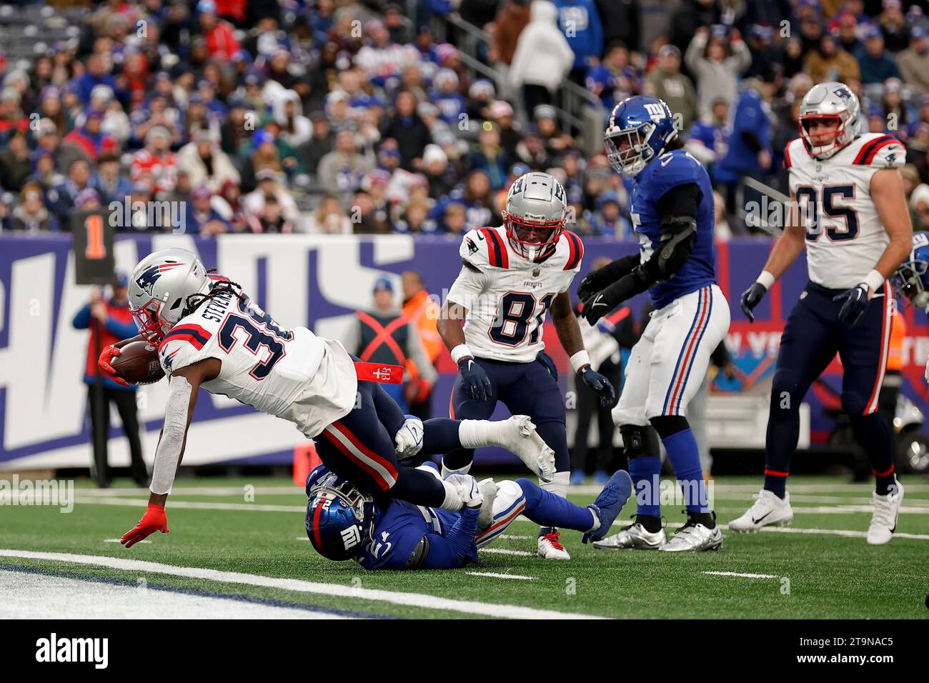 New England Patriots running back Rhamondre Stevenson (38) crosses the ...