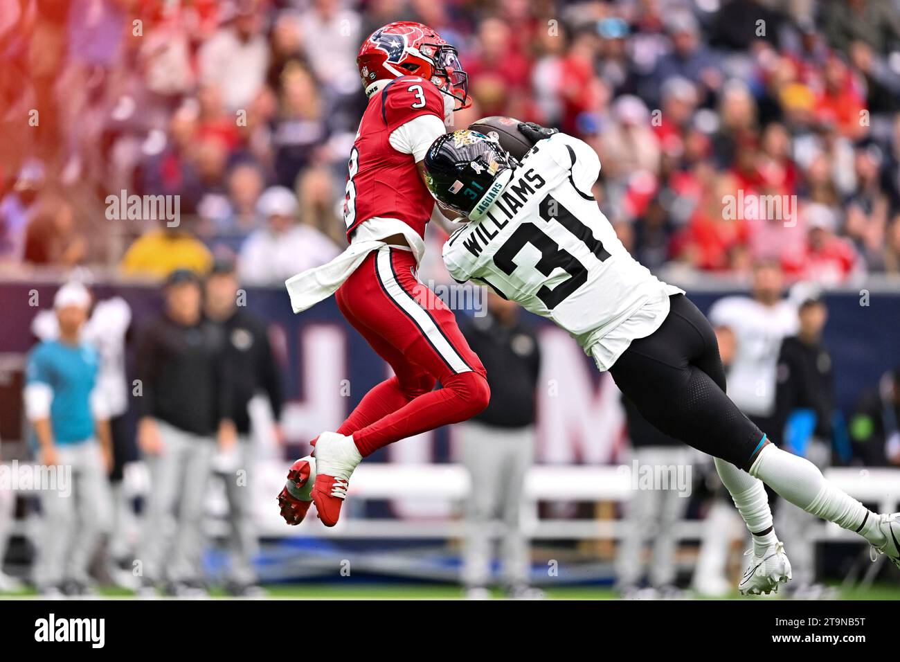 Houston Texans wide receiver Tank Dell (3) and Jacksonville Jaguars ...