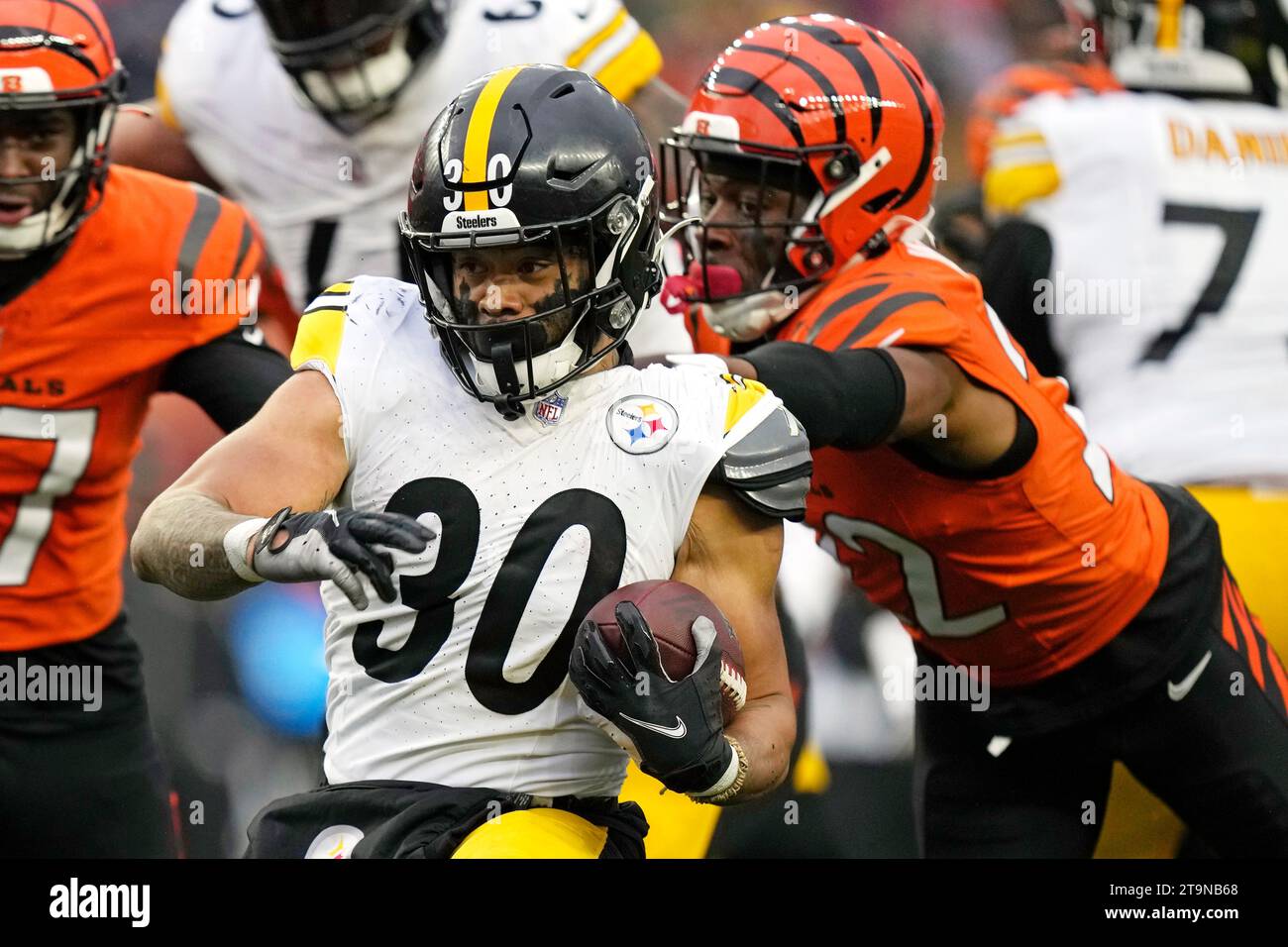 Pittsburgh Steelers running back Jaylen Warren (30) is tackled by ...