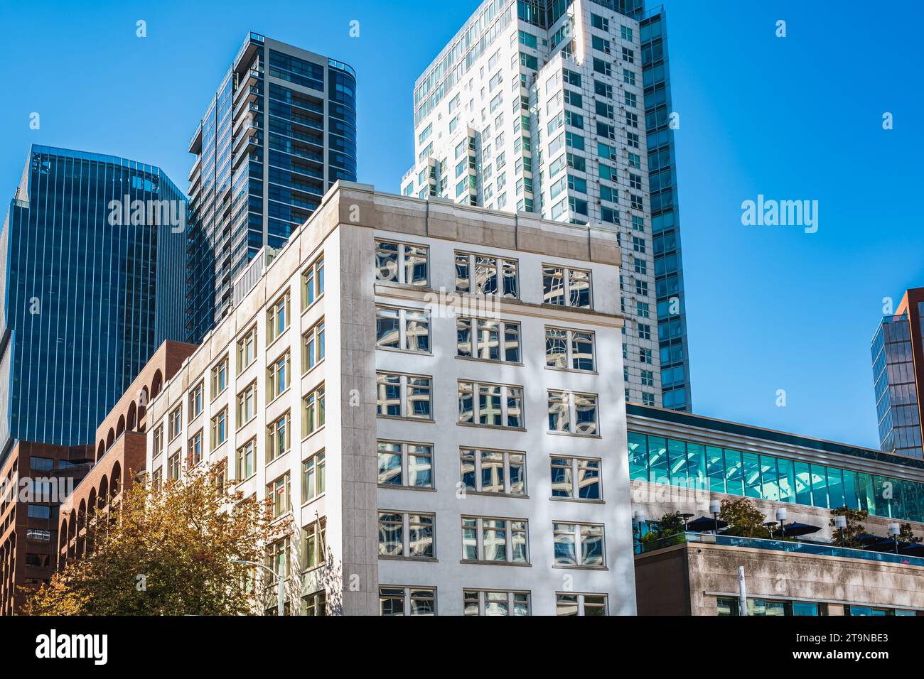 Skyscape of a group of modern office buildings in Vancouver BC. Glass ...