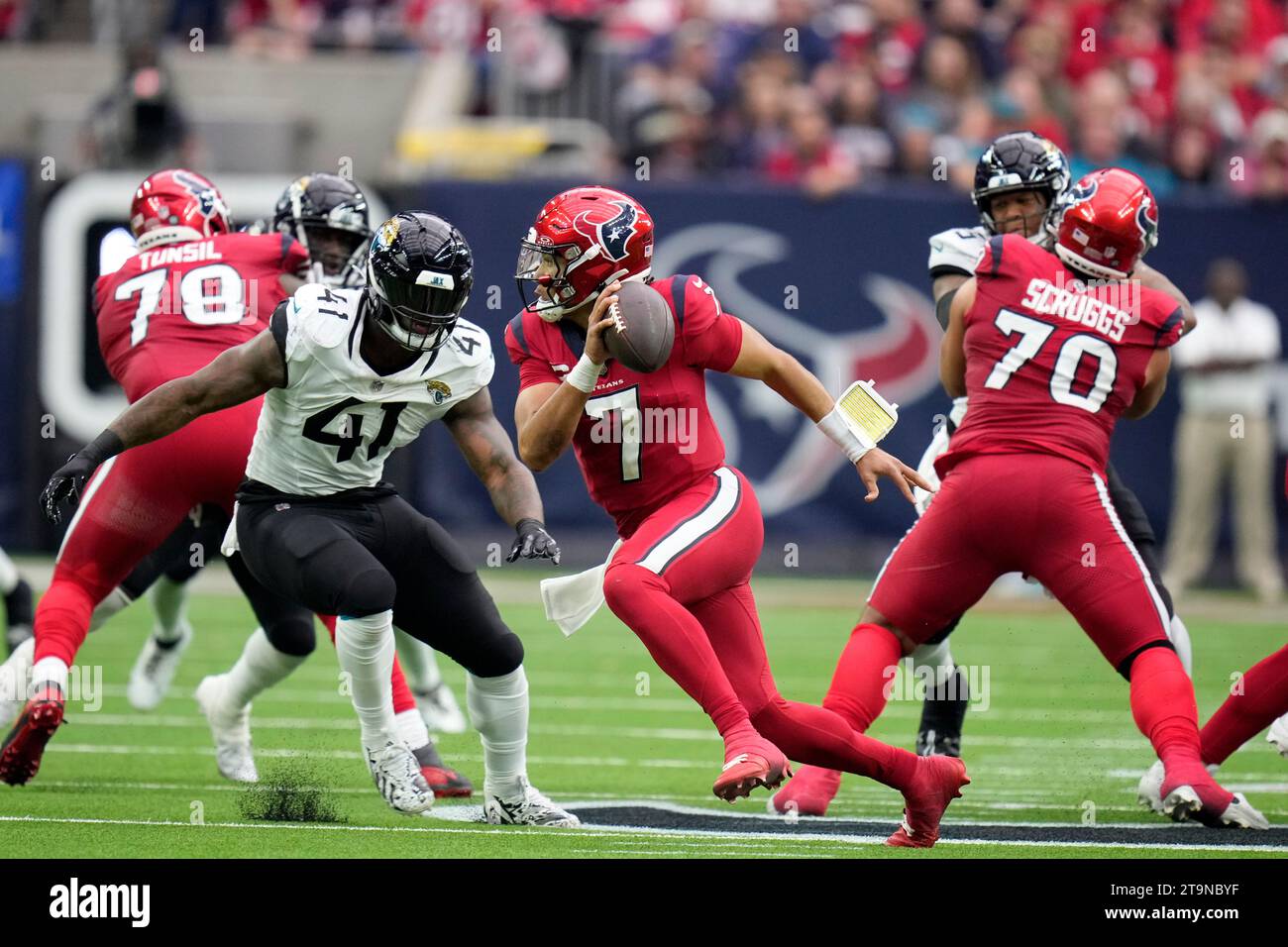 Houston Texans quarterback C.J. Stroud (7) scrambles before being ...