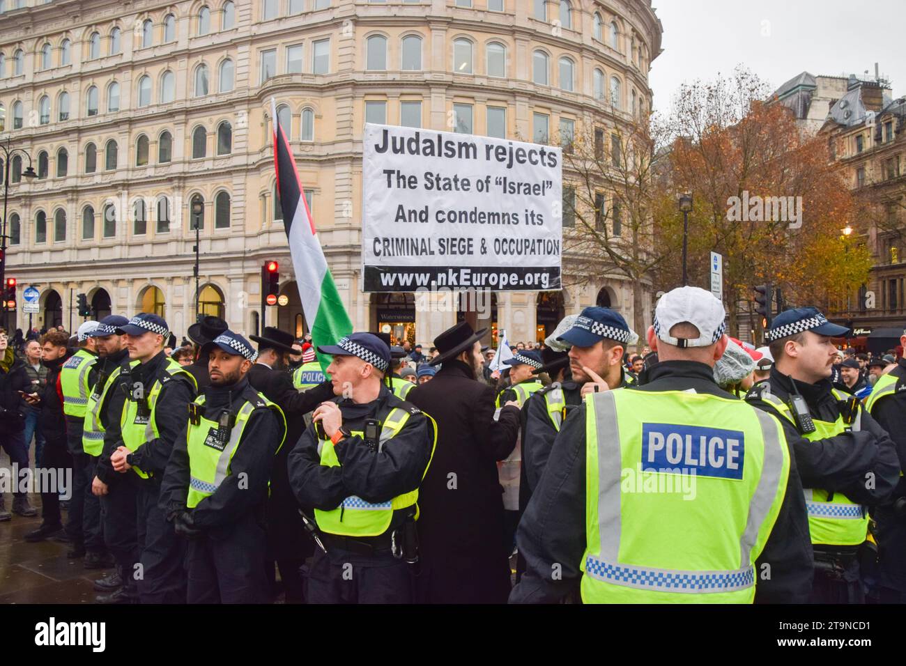 London, UK. 26th November 2023. Police officers intervene as anti ...