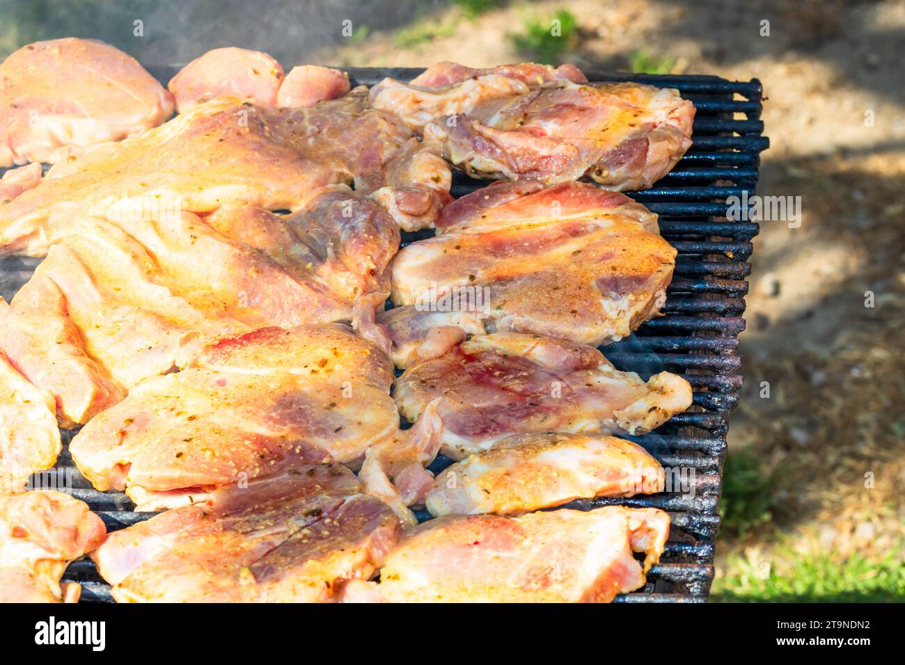 Raw steak on a charcoal barbeque. Top view of camping tasty barbecue ...