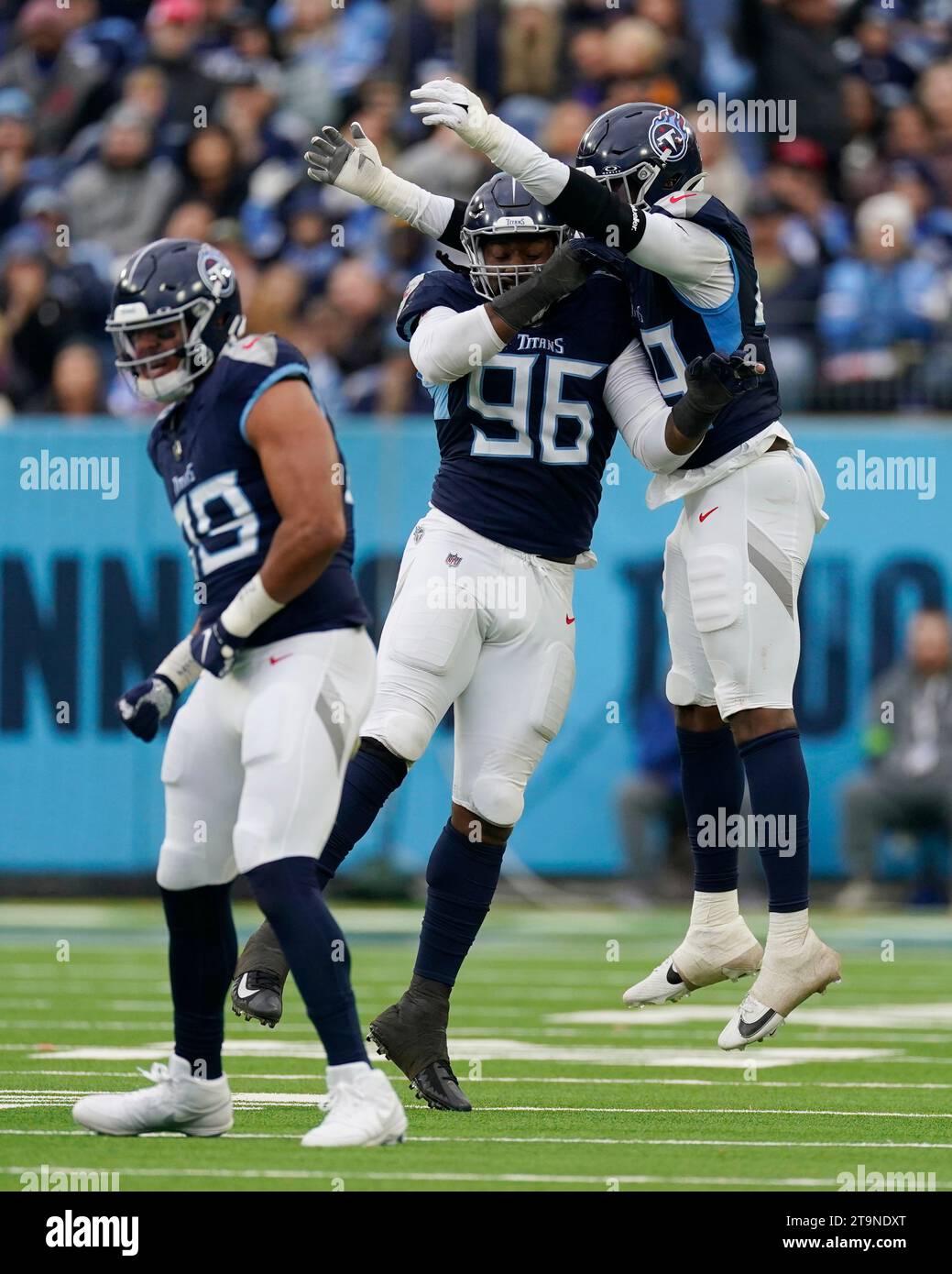 Tennessee Titans defensive end Denico Autry (96) and linebacker Arden ...
