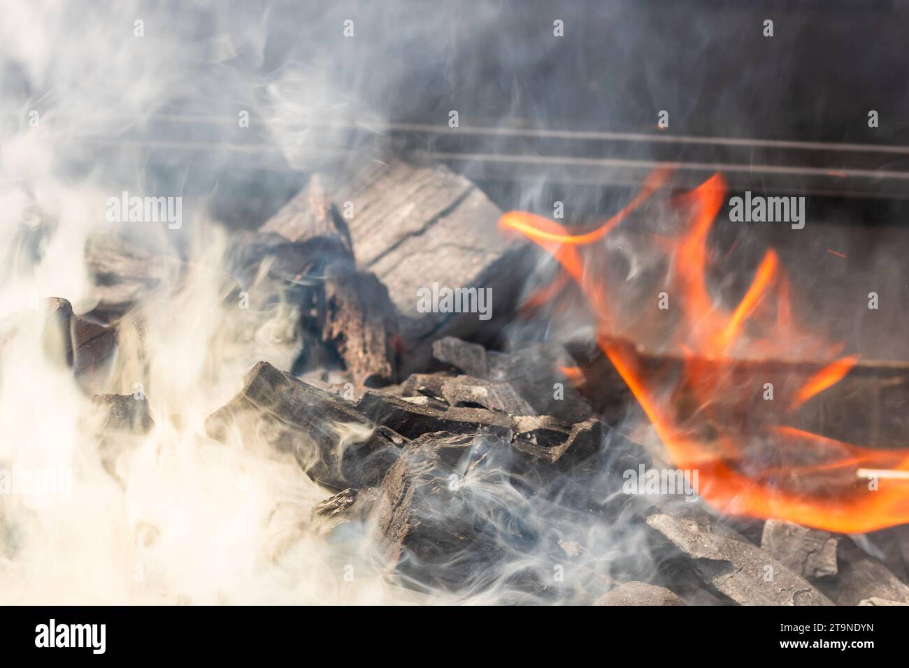 Barbecue grill pit with glowing and flaming hot open fire with red ...