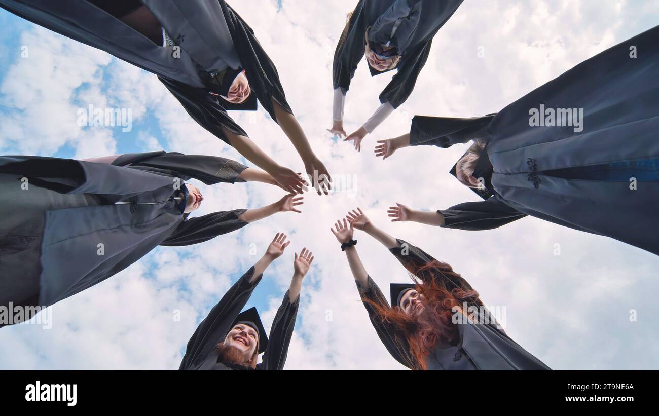 Team of college or university students celebrating graduation. Group of ...