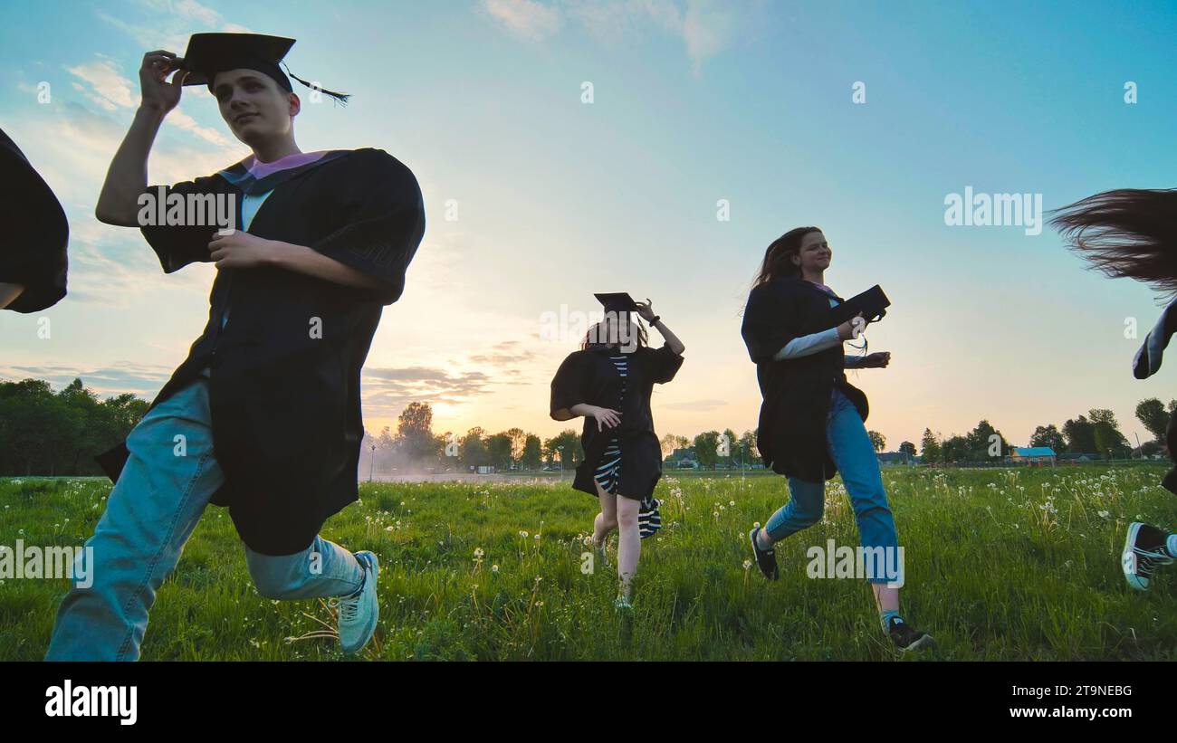 Graduates run hi-res stock photography and images - Alamy