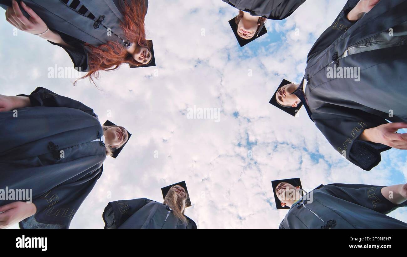 College students stand in a circle wearing black robes Stock Photo - Alamy