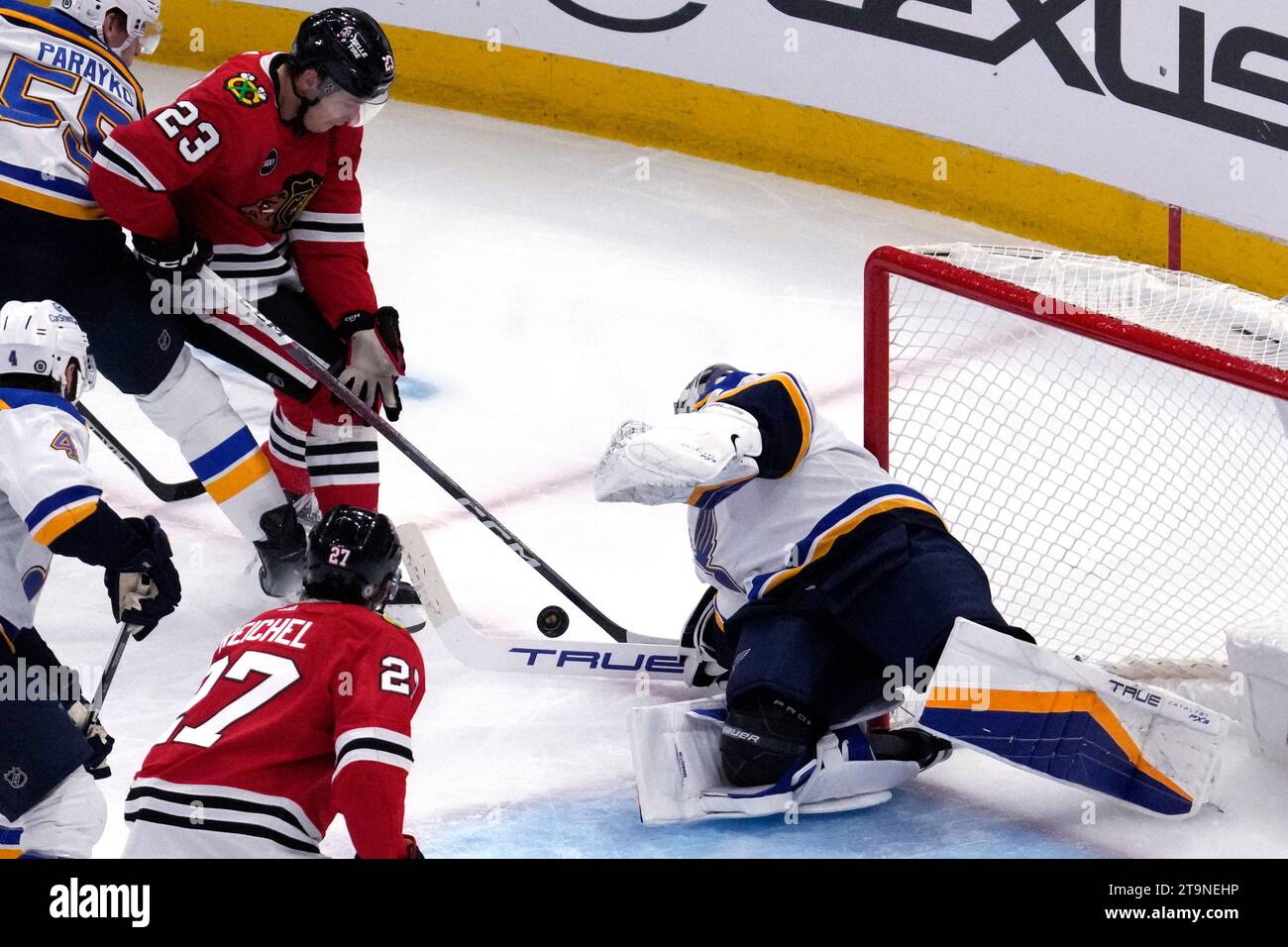 St. Louis Blues goaltender Jordan Binnington, right, saves a shot by ...