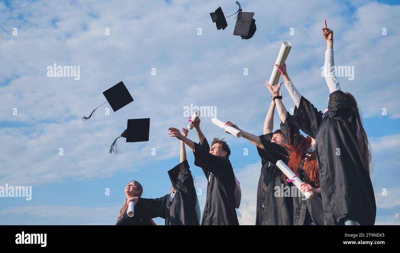 Graduation Caps Thrown in the Air Stock Photo - Alamy