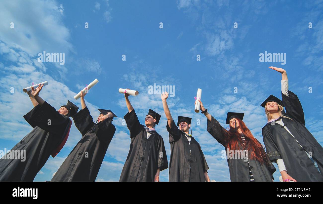 Male graduating student raised hi-res stock photography and images - Alamy