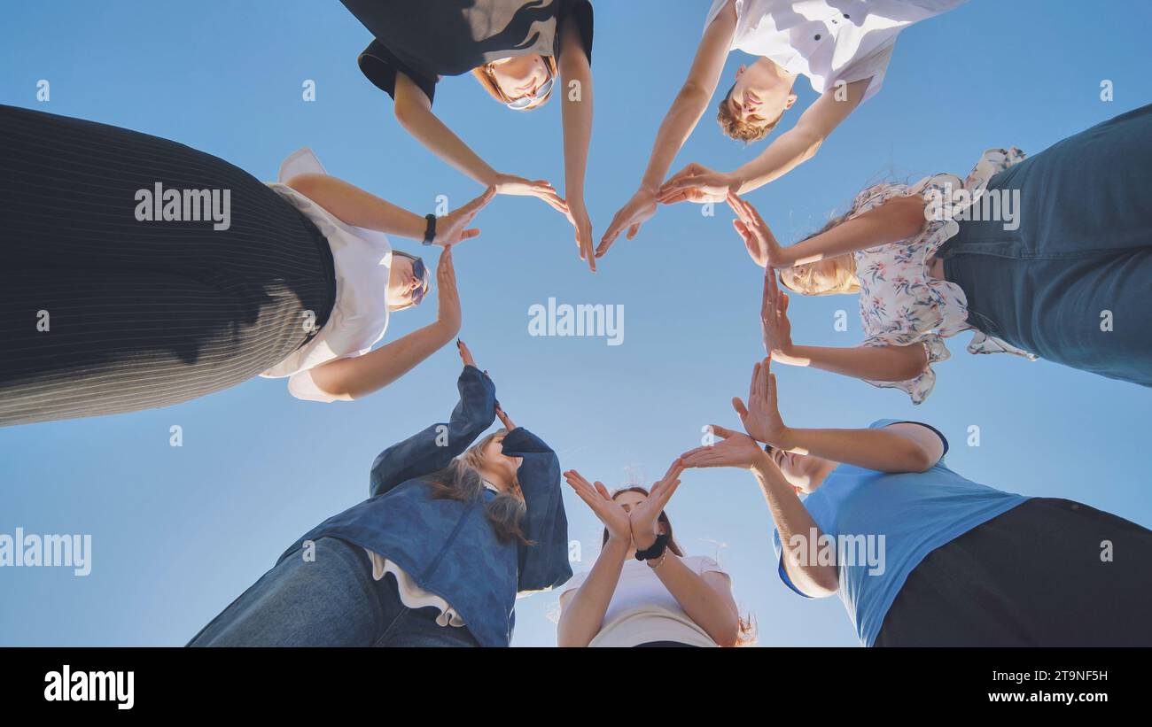 School children make a heart shape from their hands Stock Photo - Alamy