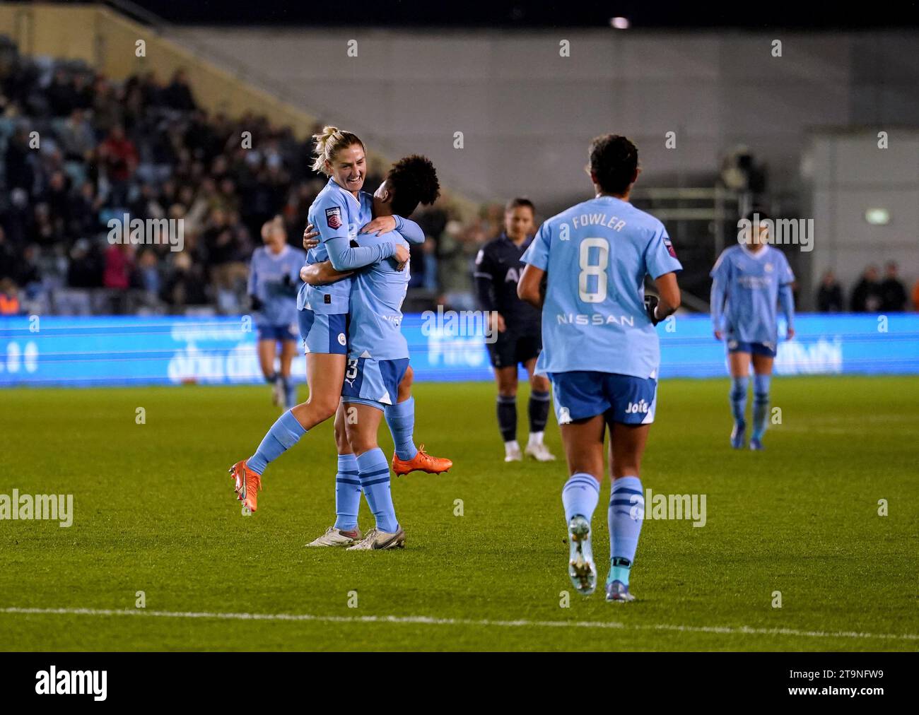 Manchester City's Laura Coombs (left) celebrates after scoring their ...