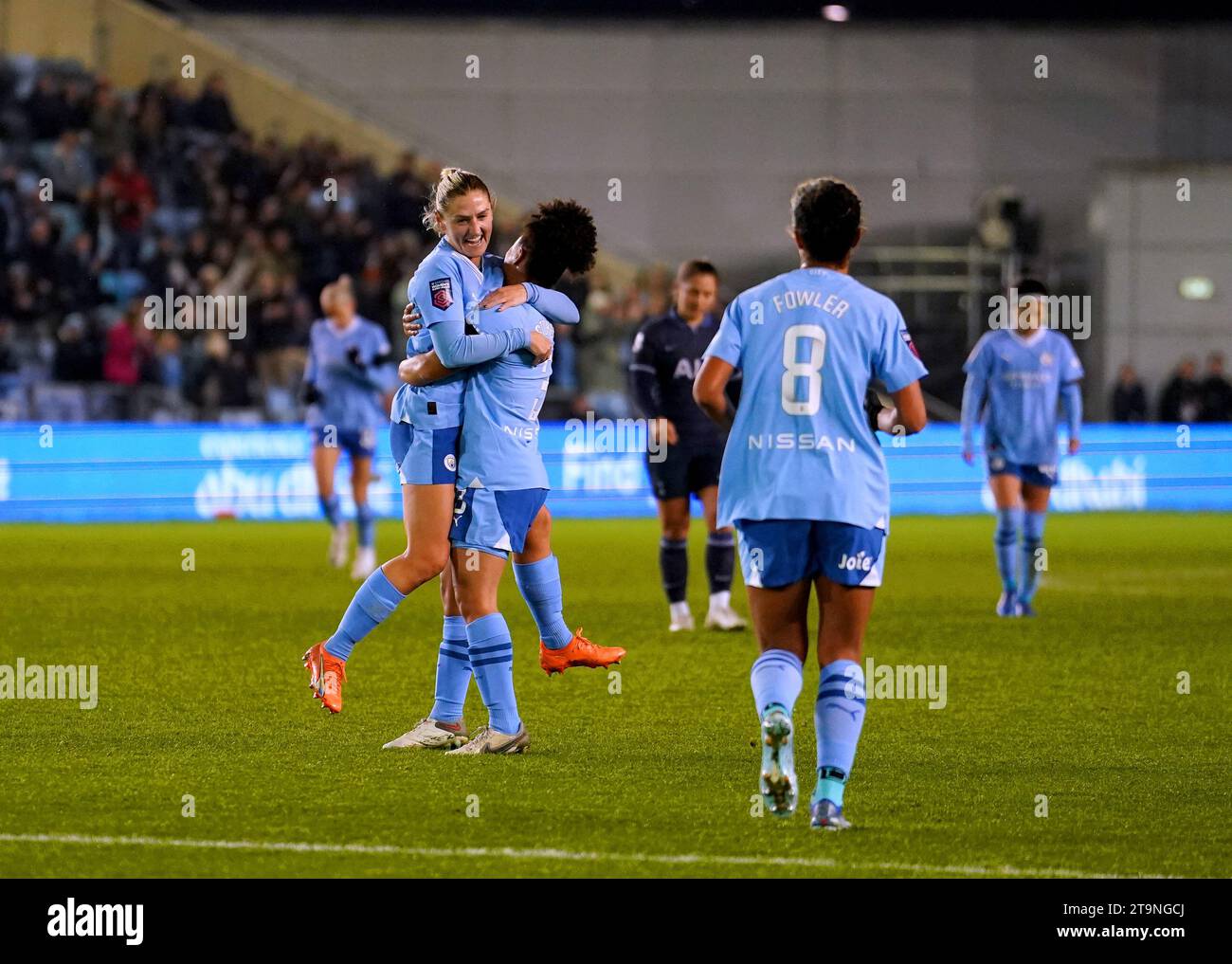 Manchester City's Laura Coombs (left) celebrates after scoring their ...