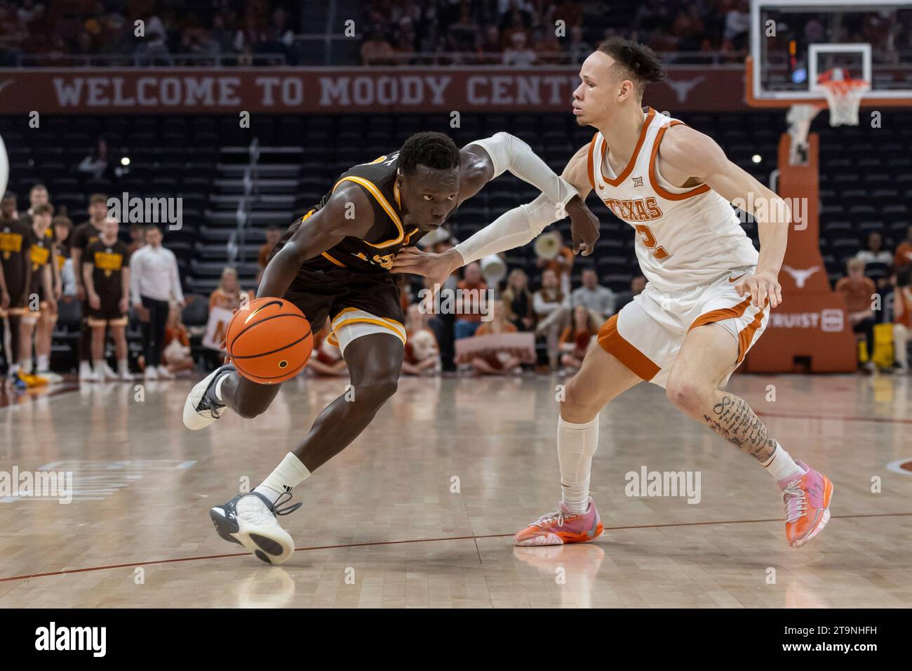 AUSTIN, TX - NOVEMBER 26: Wyoming Cowboys guard Akuel Kot (13) drives ...
