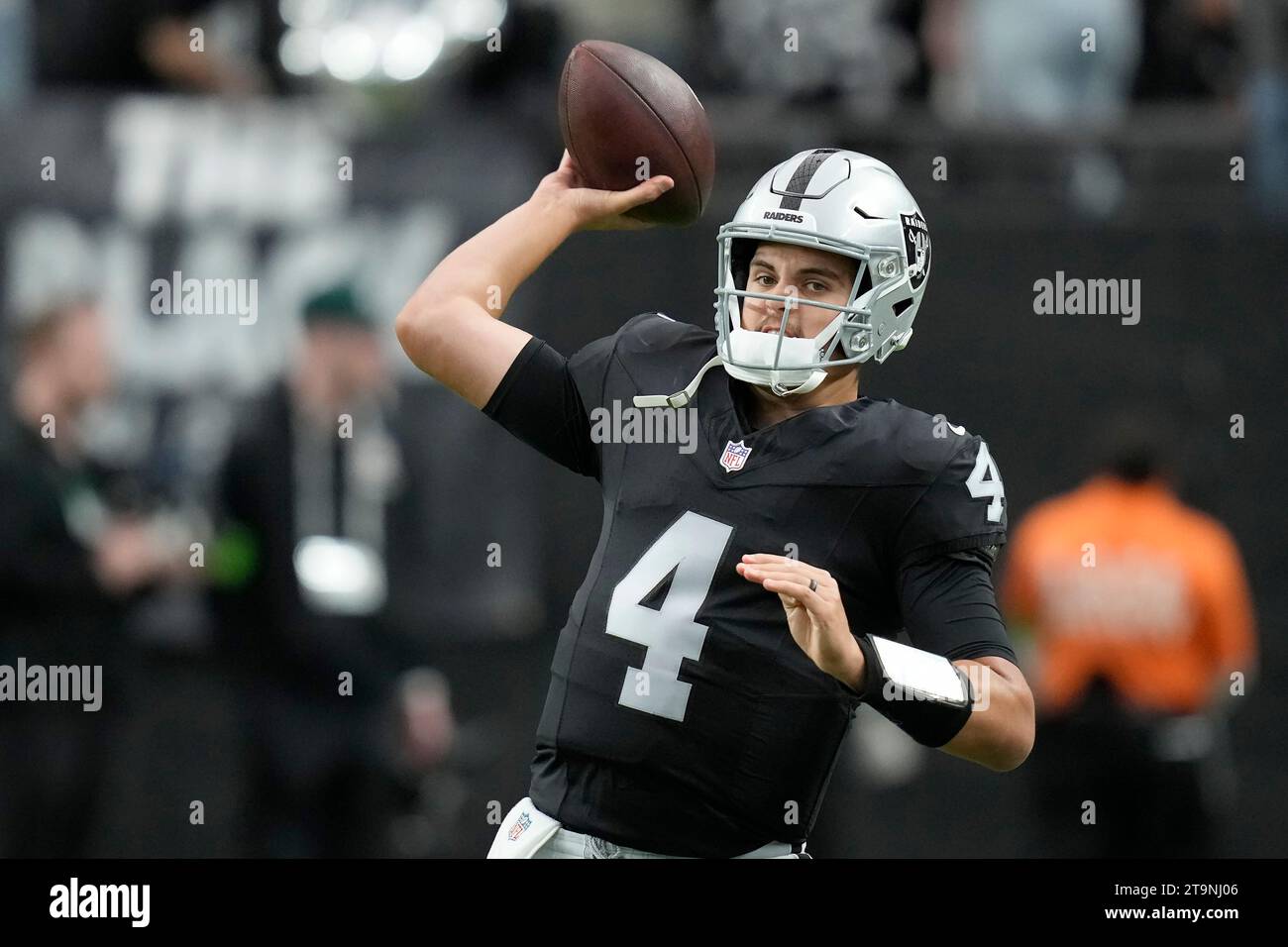 Las Vegas Raiders quarterback Aidan O'Connell (4) warms up before an ...