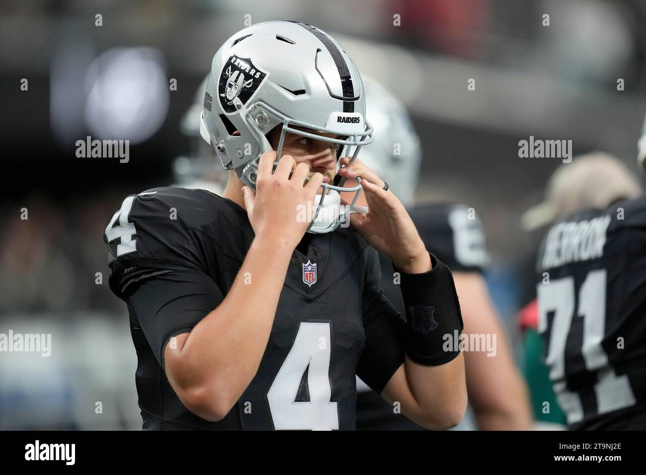 Las Vegas Raiders quarterback Aidan O'Connell (4) warms up before an ...