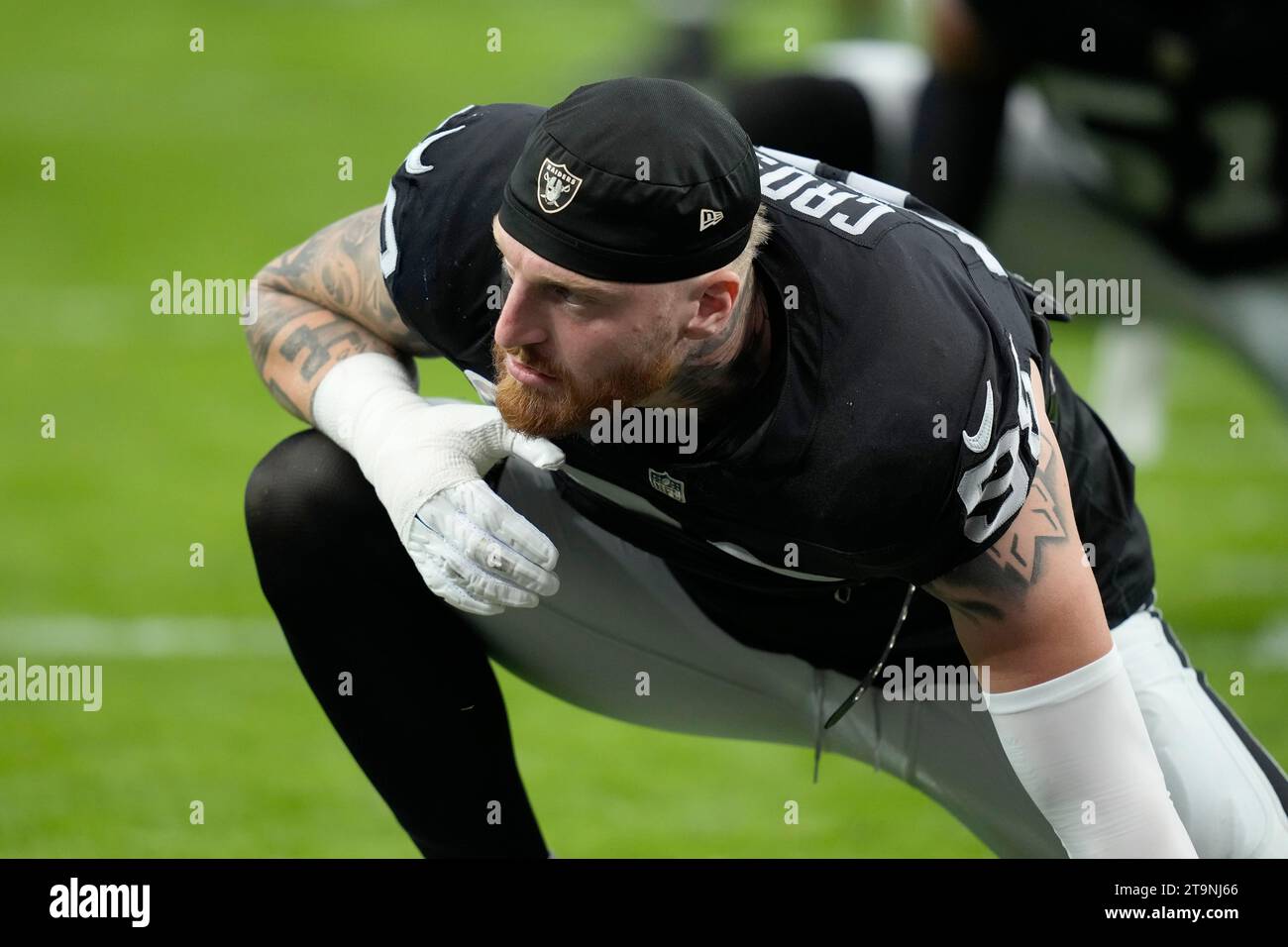 Las Vegas Raiders defensive end Maxx Crosby warms up before an NFL ...
