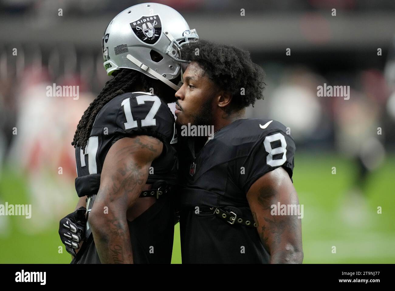 Las Vegas Raiders wide receiver Davante Adams (17) greets running back ...