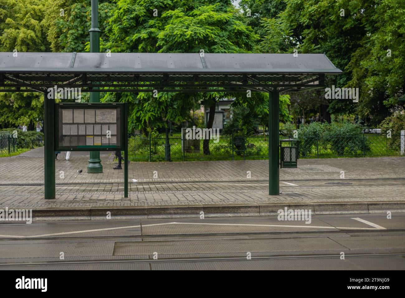 Typical bus or tram station in green color with roof as seen in the ...