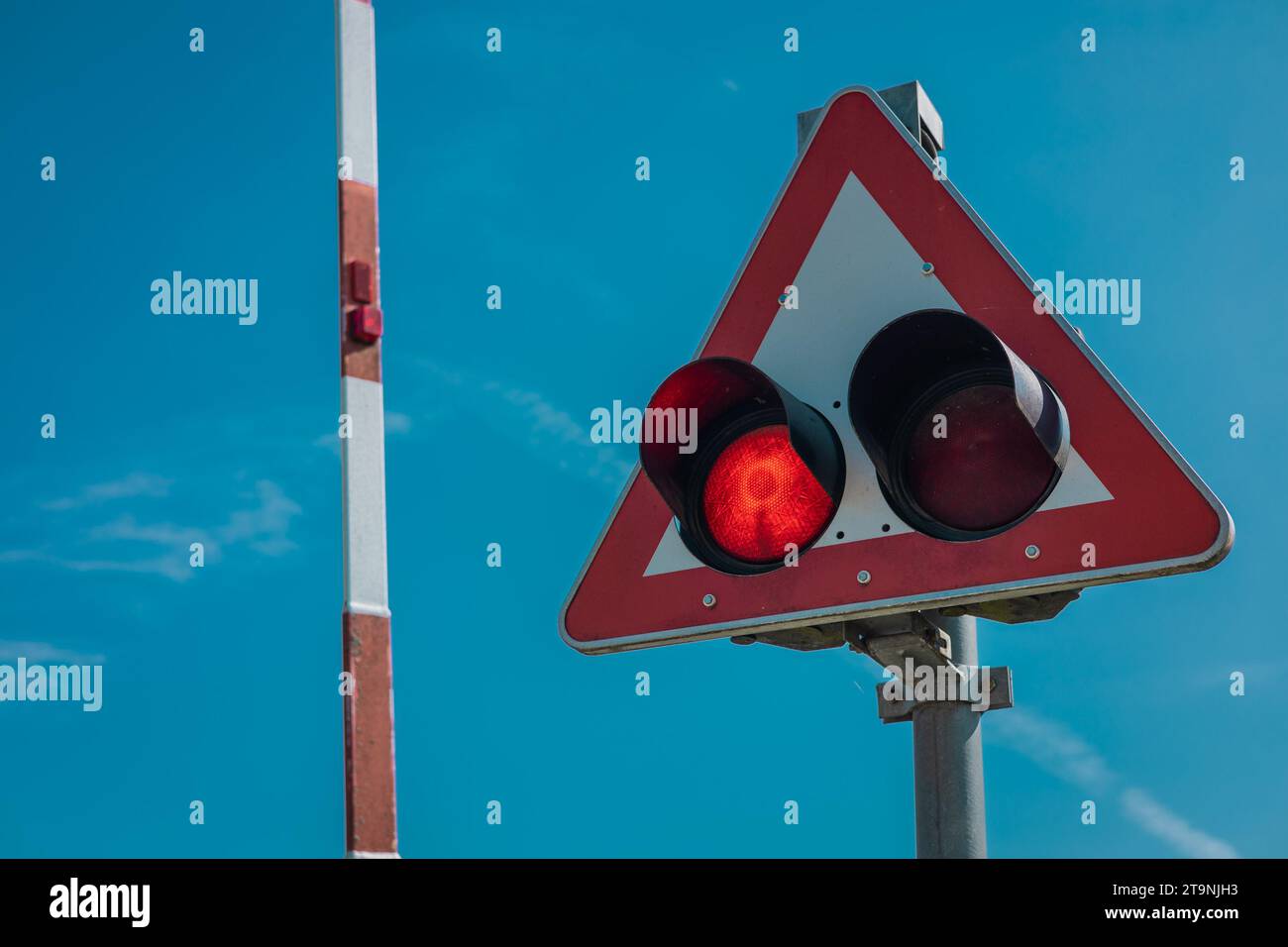 Train lights or train signal with barrier behind it waiting to be ...