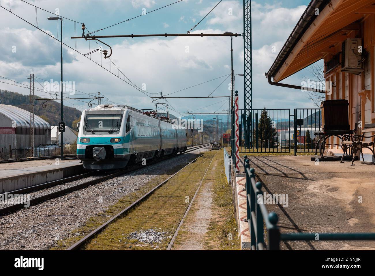 Older type of high speed train is rushing through the station of ...