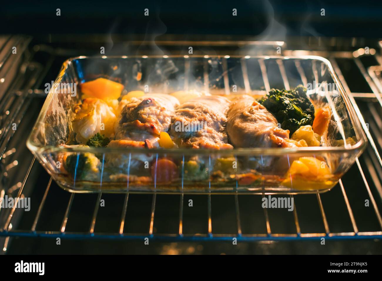 Cooking chicken legs in the oven. Hot, home-cooked food. Food ...