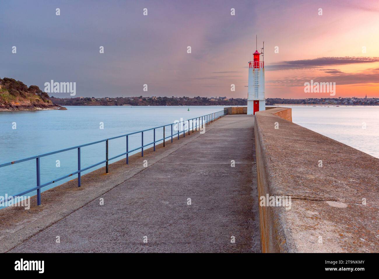 Lighthouse in medieval walled city and fortress Saint-Malo at sunset ...