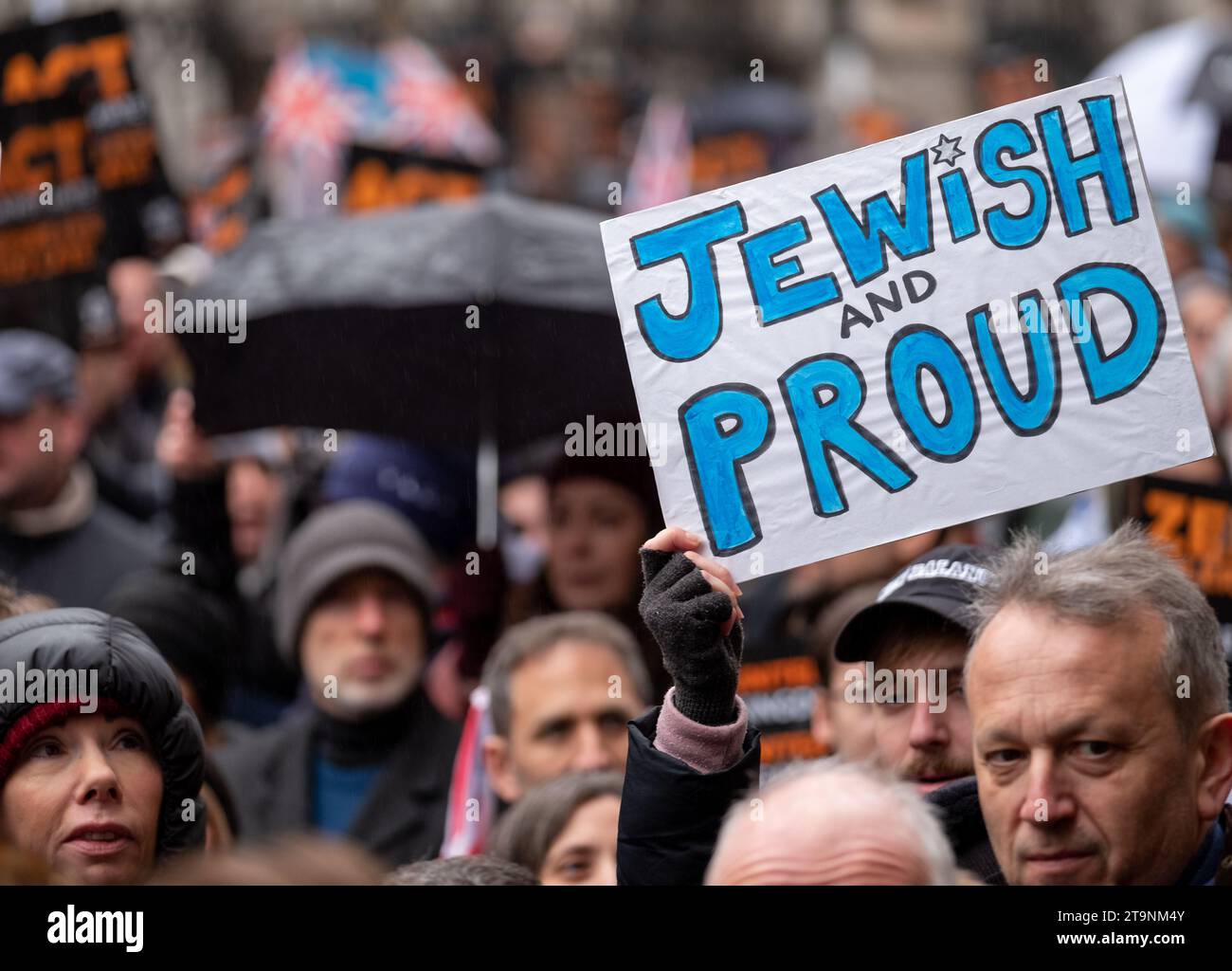Crowds holding banner saying 'Jewish and Proud', at the March Against ...