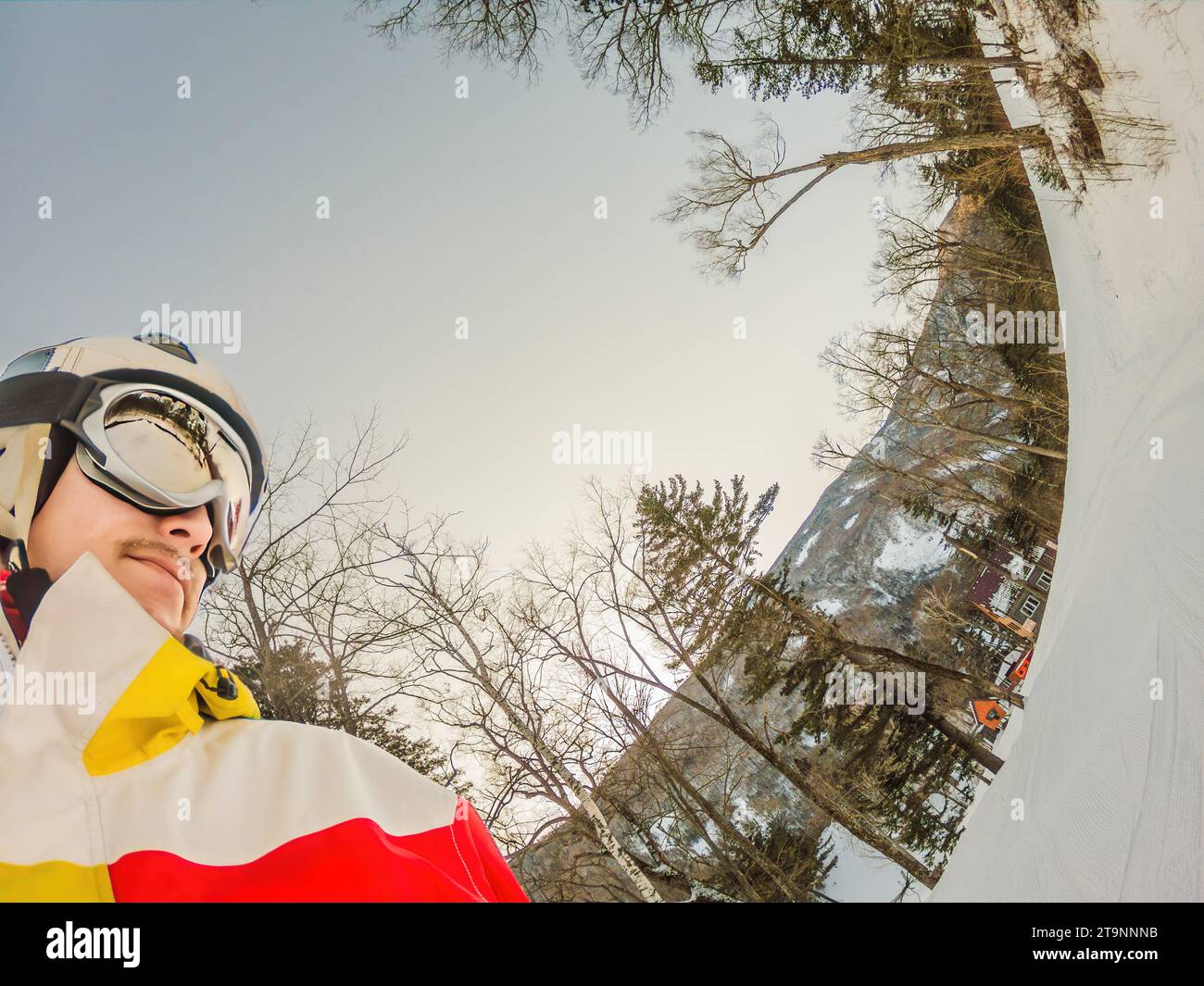 A daring man conquers snowy slopes with style, showcasing skill and ...